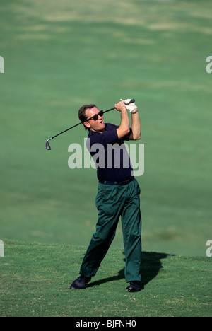 man golfer in action on a golf course Stock Photo - Alamy