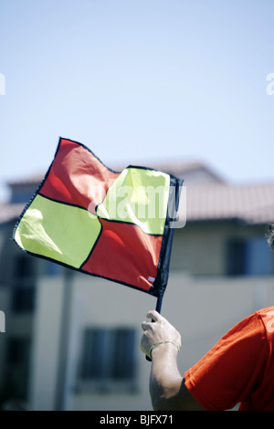 The linesman raises his flag Stock Photo - Alamy