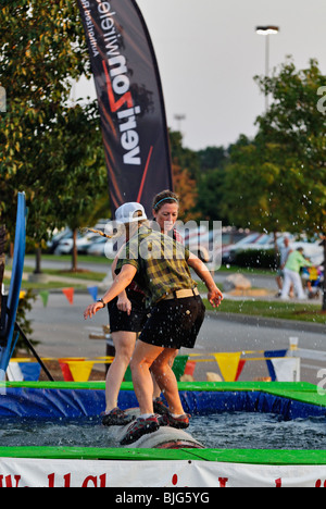 Lumberjacks compete in the log rolling competition during the Great ...