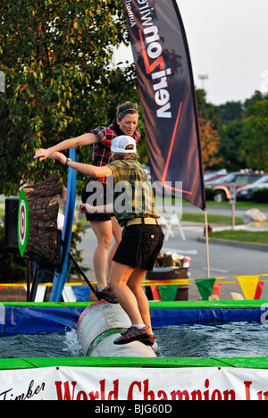 Lumberjacks compete in the log rolling competition during the Great ...