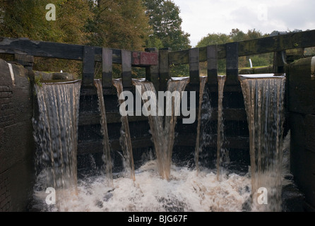 Water flowing through the lock gate system and waterfall at Beeleigh ...