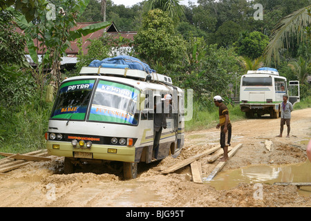 A bus travels the mud roads of Indonesian Borneo Stock Photo - Alamy