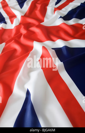 A vertical shot of the flag of Great Britain in front of the old ...