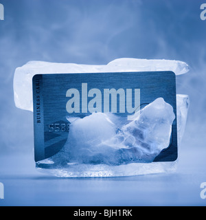 credit card frozen in a solid block of ice Stock Photo - Alamy