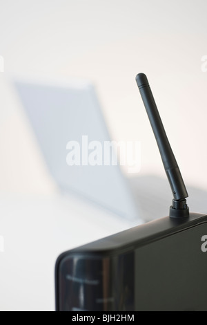 closeup of a wireless router and Laptop computers on living room at ...