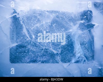 credit card frozen in a solid block of ice Stock Photo - Alamy
