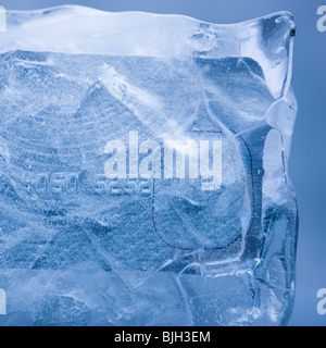 credit card frozen in a solid block of ice Stock Photo - Alamy