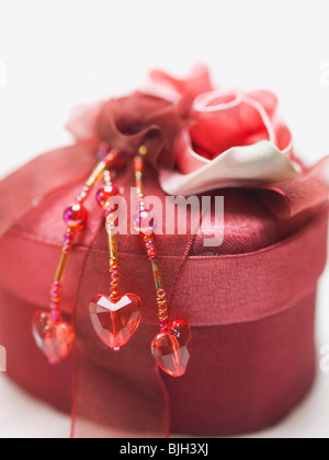 Giving a red heart shaped gift on Valentine`s Day Stock Photo - Alamy
