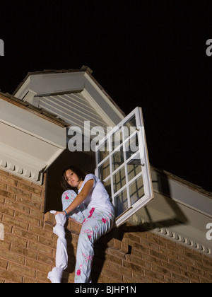teenager climbing out of her bedroom window Stock Photo - Alamy