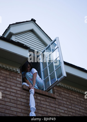 teenager climbing out of her bedroom window Stock Photo - Alamy