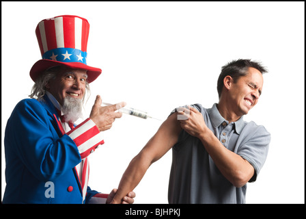 uncle sam giving a man an injection Stock Photo - Alamy