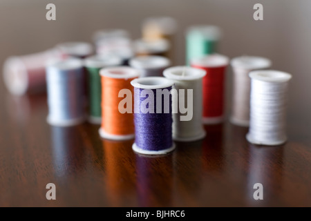 Colorful sewing thread spools close up. Full frame background, top view ...