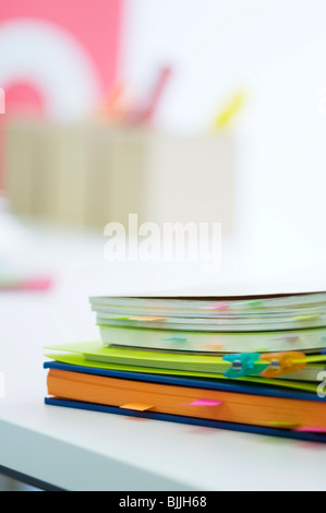 Notebooks with color coded tabs Stock Photo - Alamy