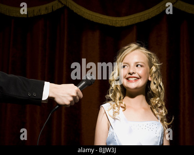 Girl beauty pageant contestant with microphone looking nervous Stock ...