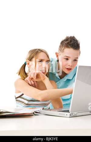 Work together. Blonde girl helping teens with their project work Stock ...