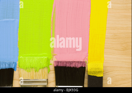 Four paint brushes with stripes of paint Stock Photo - Alamy