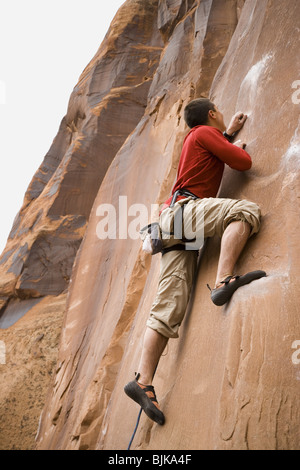 Back view of sport man with ripped athletic and muscular legs running ...