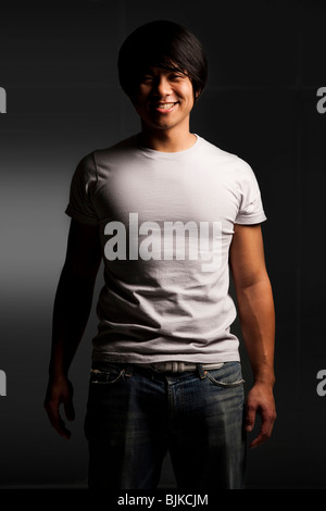 Muscular man with tensed arm looking hostile Stock Photo - Alamy