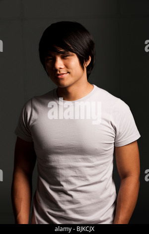 Muscular man with tensed arm looking hostile Stock Photo - Alamy