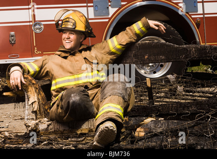 Portrait of a firefighter smiling Stock Photo - Alamy