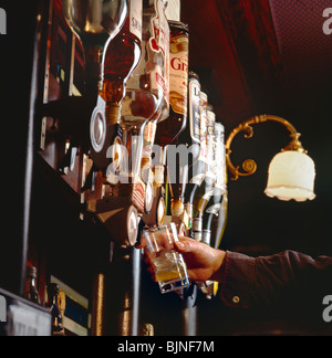 PUB SPIRITS OPTICS MEASURE Variety of popular spirit bottles in a line ...