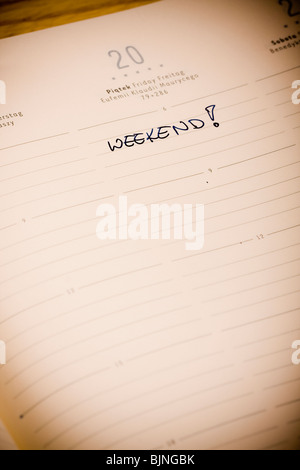 Weekend marked in calendar Stock Photo - Alamy