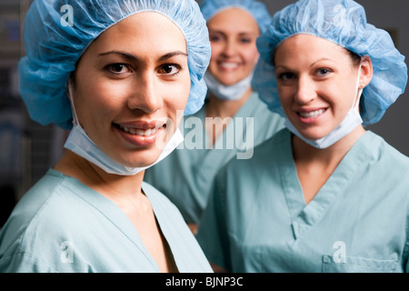 Nurses in scrubs check supplies in the Surgical storeroom in an NHS ...