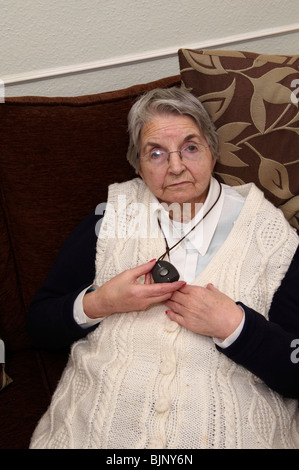 Elderly lady with emergency alarm around neck Stock Photo - Alamy