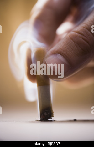 putting out a cigarette Stock Photo - Alamy