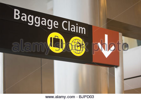 A luggage porter at the baggage claim area of Terminal 4 at JFK Stock ...
