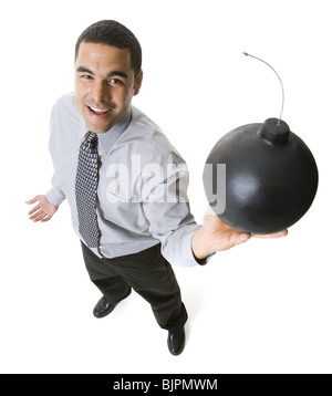 Man holding a cannonball Stock Photo - Alamy