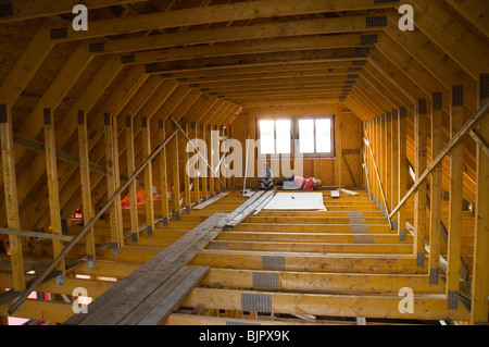 An under construction house has joist framework features plywood ...