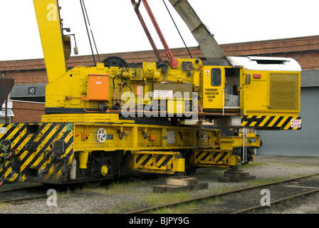 Cowans Sheldon 75 tonne strut jib rail crane. Stowing the jib on to the ...