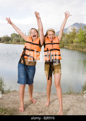 two girls in life vests Stock Photo - Alamy
