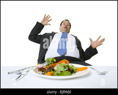 Man falling off a chair Stock Photo - Alamy