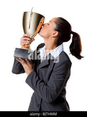 successful woman holding trophy above head while sitting on chair ...