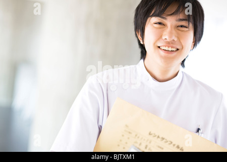 X-ray technician smiling at the camera Stock Photo - Alamy