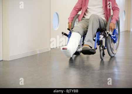 Man with broken leg in a wheelchair Stock Photo - Alamy