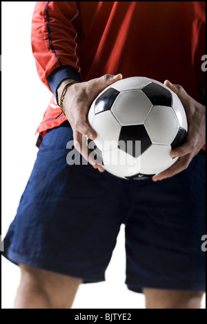 Soccer player holding groin Stock Photo - Alamy