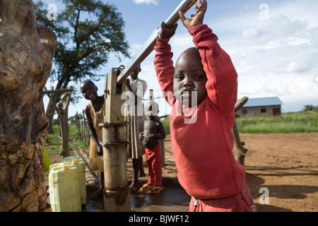 Boy fetching water at borehole in rural Botswana Stock Photo - Alamy