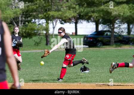 Girls high school softball. Catching running throwing. Teenage girls ...