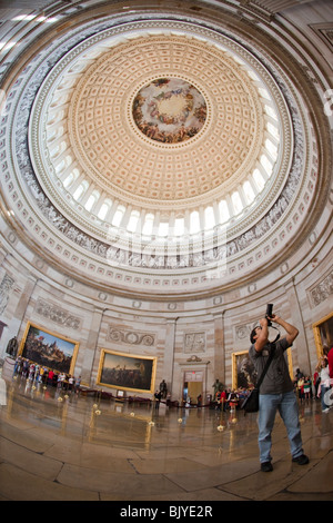 Visitors tour the Capitol Rotunda in Washington, Monday, Sept. 29, 2025 ...