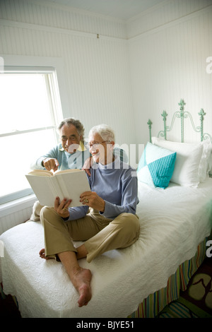 high angle view of couple reading books on couch at home Stock Photo ...