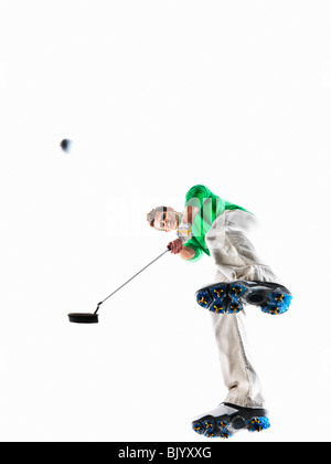 Young man playing golf on the golf course Stock Photo - Alamy