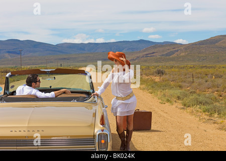 Man Picking Up Woman Hitchhiker on Country Road Stock Photo - Alamy
