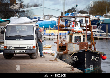 fisherman preparing a stern-trawler / shellfish dredger for inshore ...