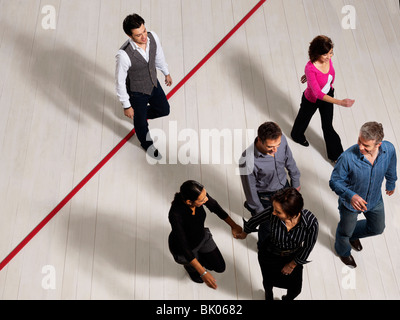 Business people crossing a red line Stock Photo - Alamy