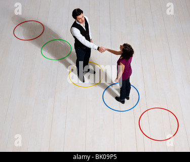 Person in circle shaking hands Stock Photo - Alamy