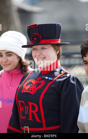 Moira Cameron. first female Beefeater, posing with tourist wearing ...