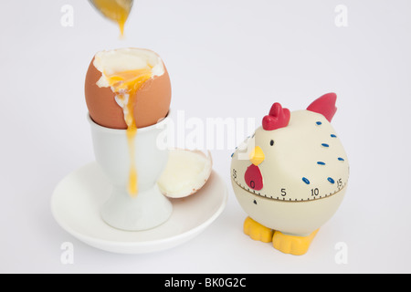 An egg timer with eggs Stock Photo - Alamy